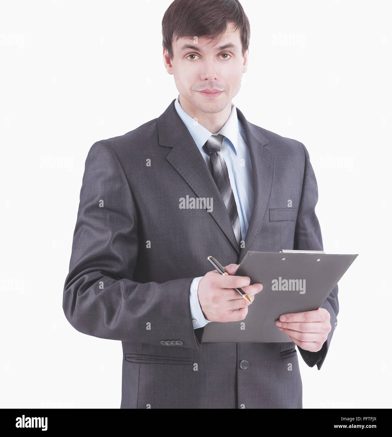 young businessman standing with working papers isolated on white Stock ...