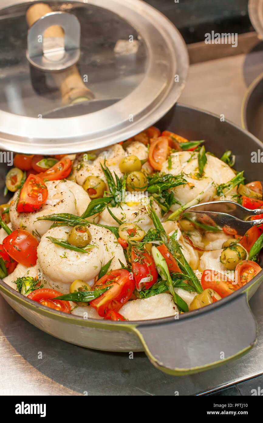 vertical shot of a Mediterranean white fish meal in a pan Stock Photo ...