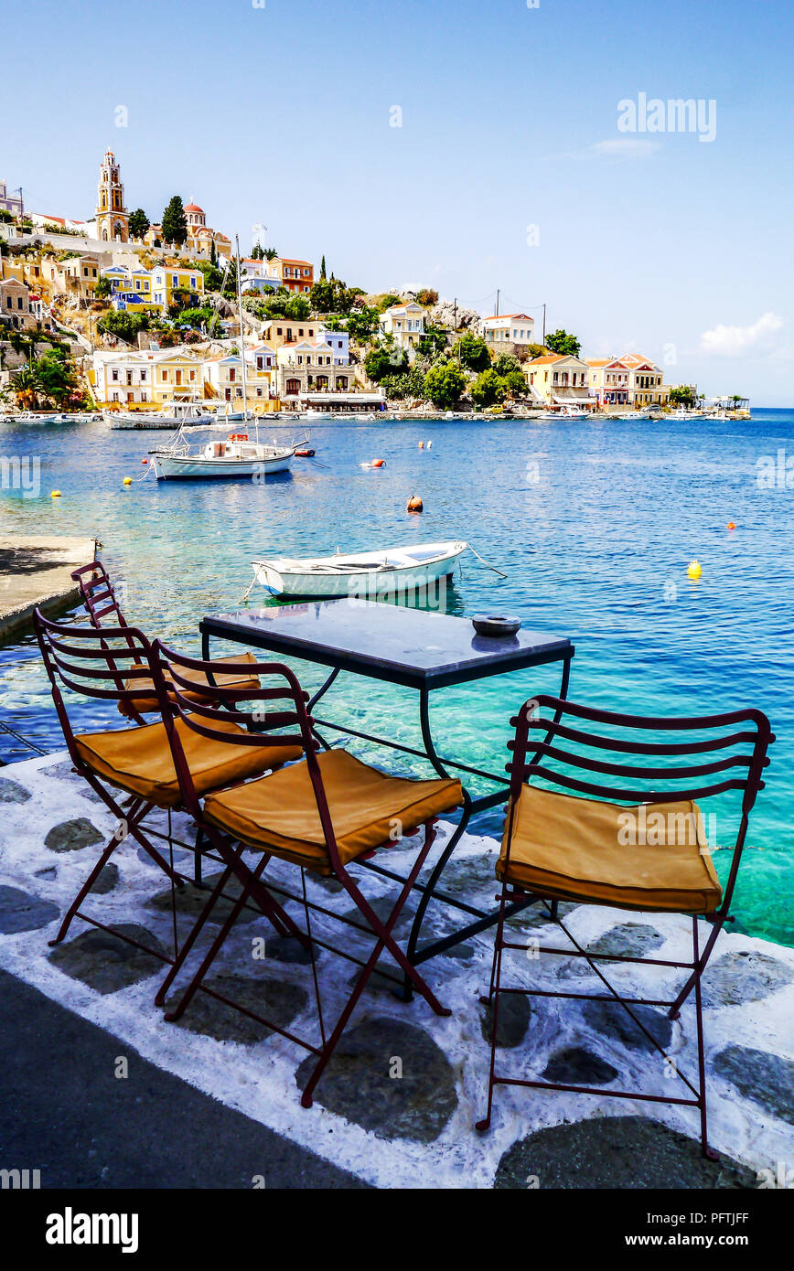 Mediterranean waterside lunch setting, Symi, Greece Stock Photo - Alamy
