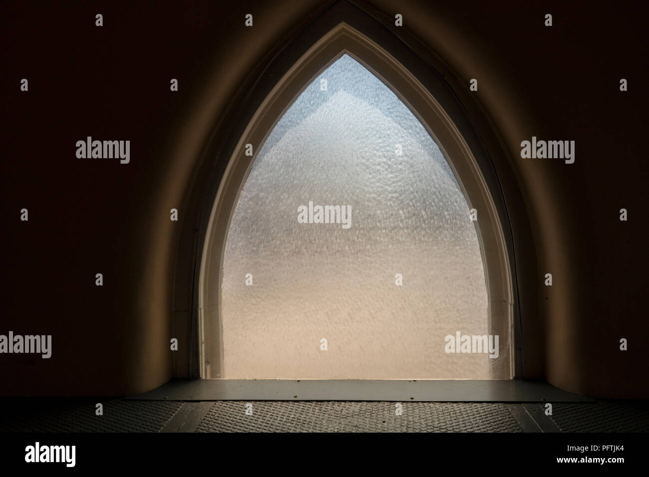 Arched window with structured glass as a background Stock Photo - Alamy