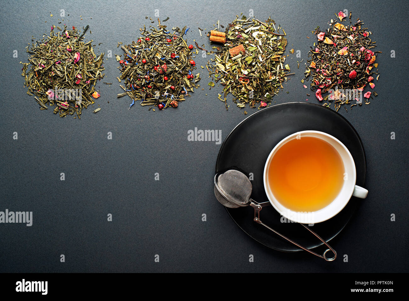 Cup of tea with dry tea collection of different types Stock Photo - Alamy
