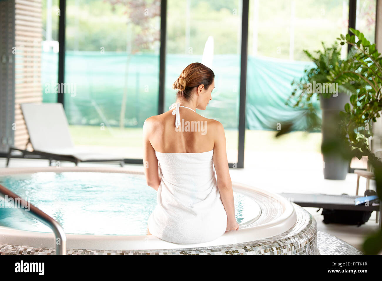 Woman relaxing at a spa in the hot tub hi-res stock photography and images - Alamy