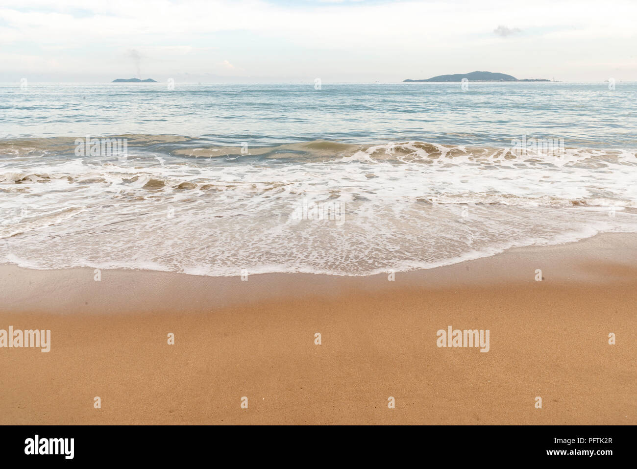 waves sand beach sunset glow, empty relaxing background Stock Photo - Alamy