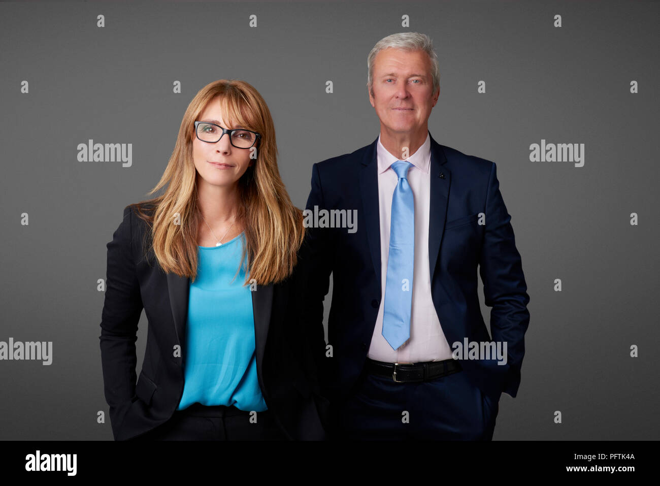 Portrait of an attractive middle aged businesswoman and a senior ...