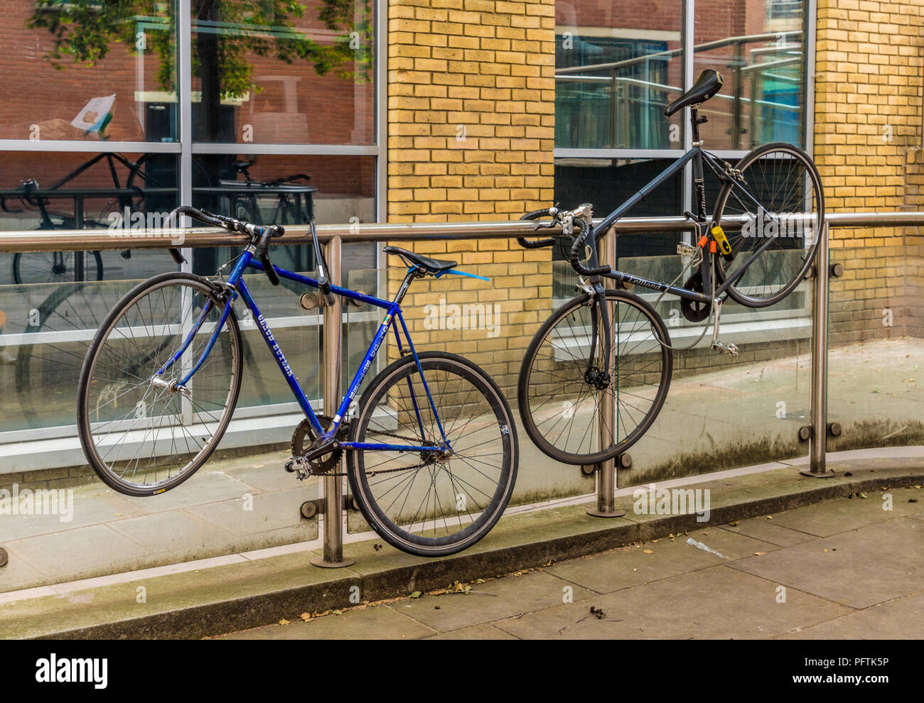 Bike bicycle chained metal railings hi-res stock photography and images ...