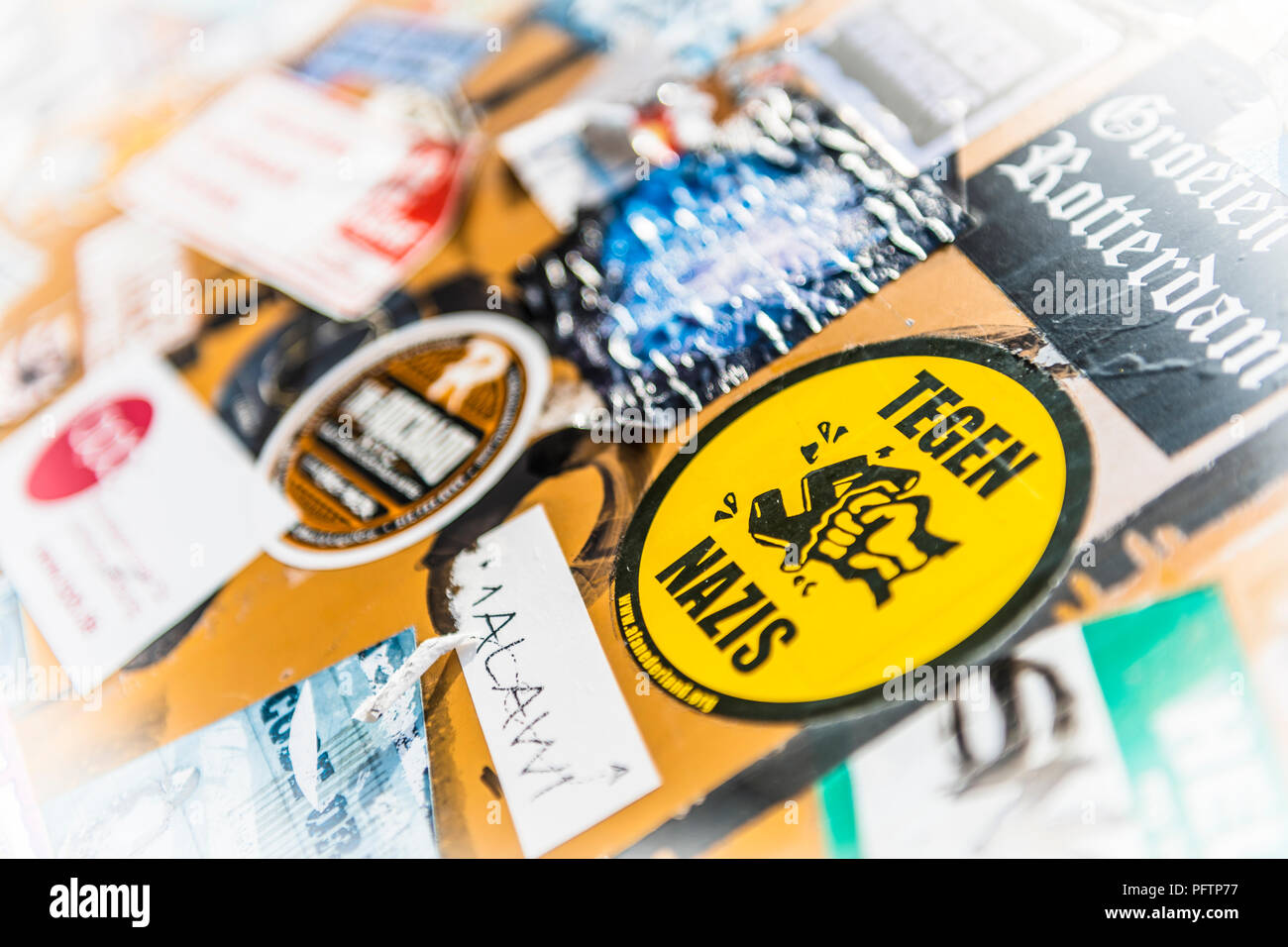A collection of random stickers on a board close to the Berlin Wall in ...