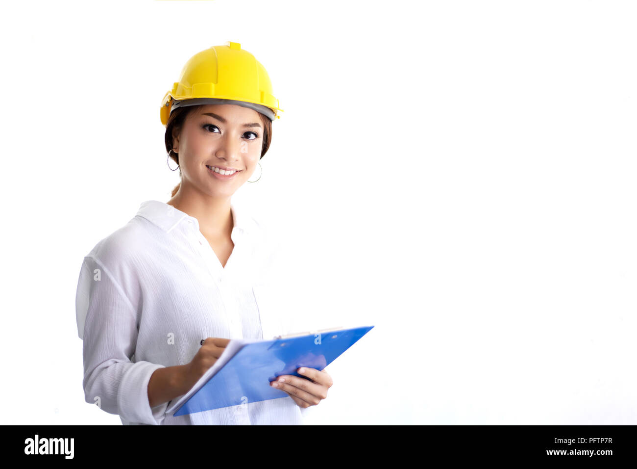 Asian women engineering inspecting and working and holding blueprints ...