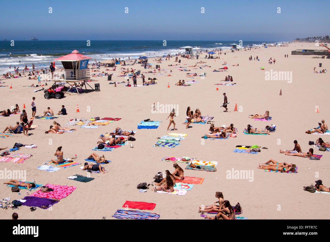 Sunbathers at Huntington Beach California Stock Photo - Alamy