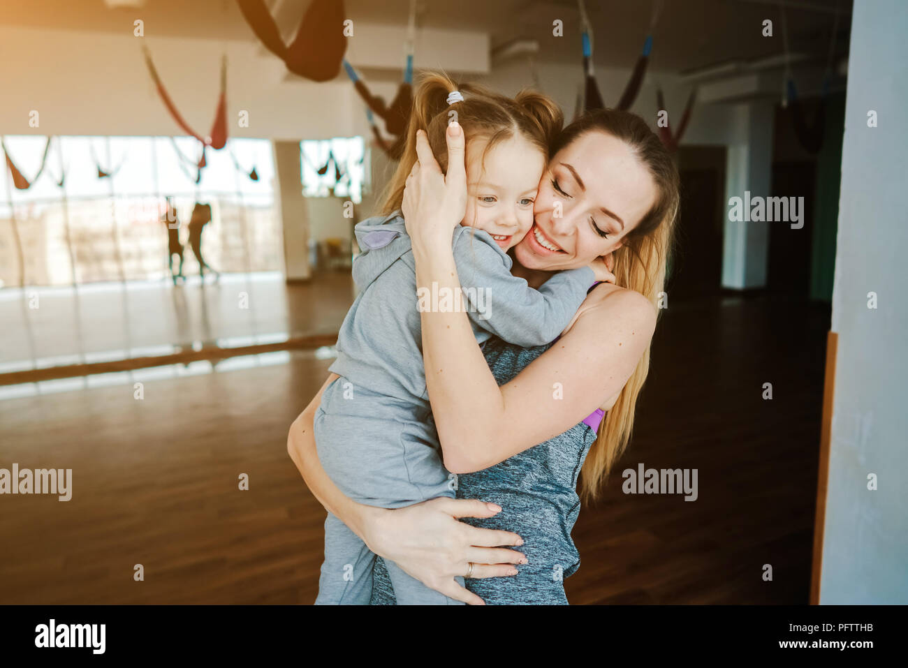 Mother holds her daughter in her arms Stock Photo - Alamy