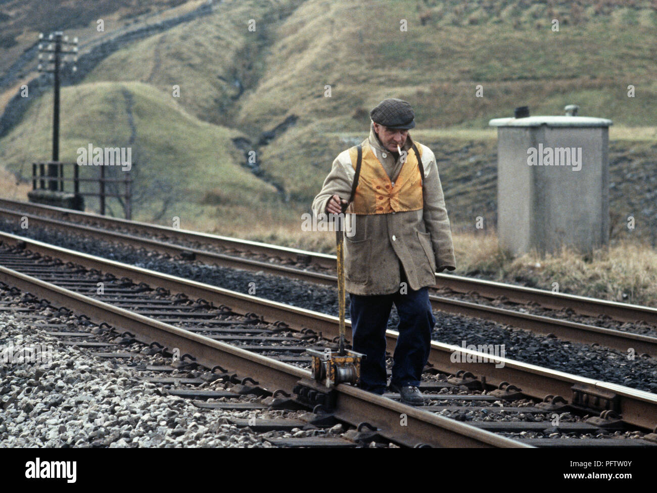 British Rail line workers wearing orange safety jackets on the Settle ...