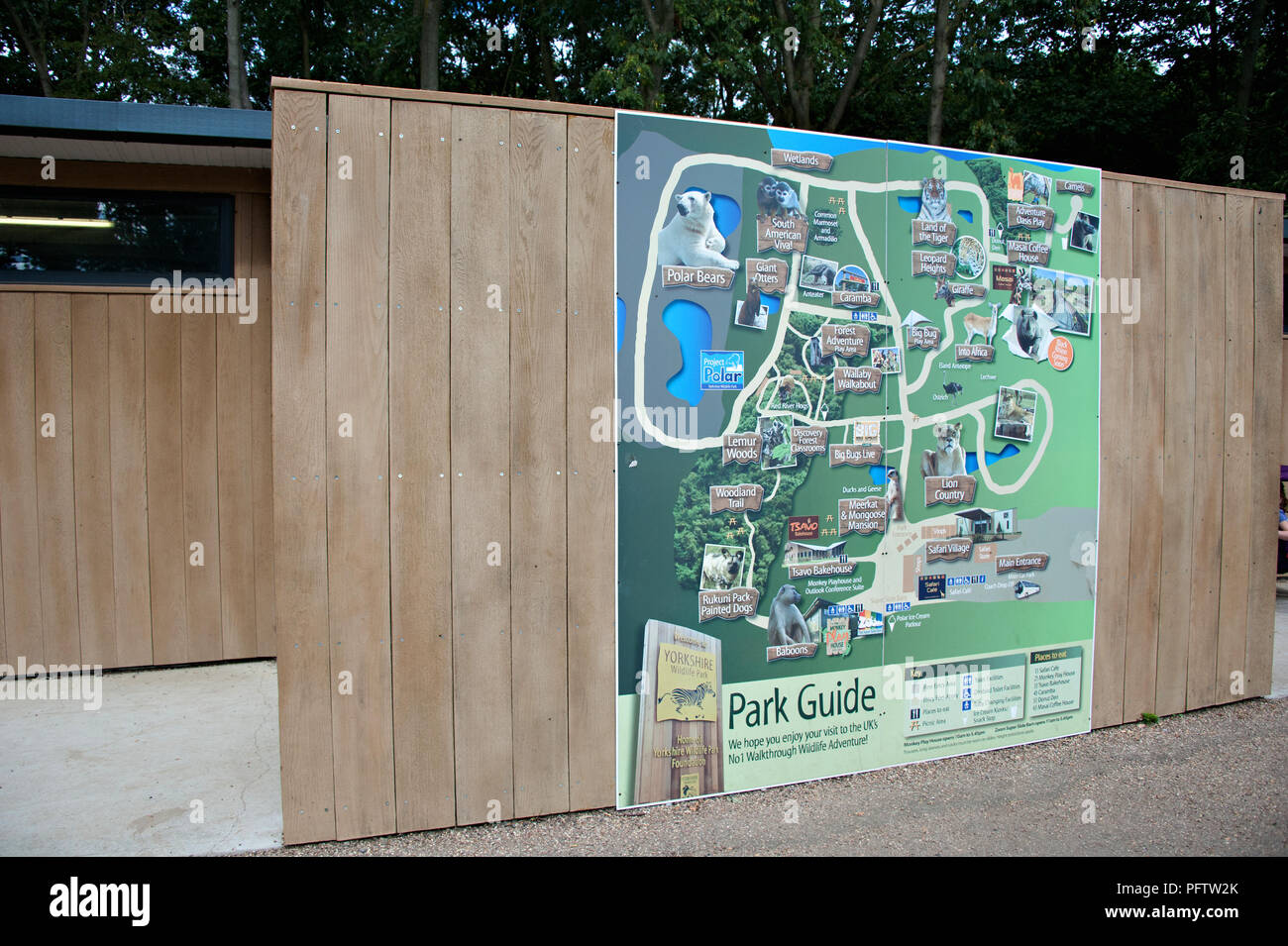 A large park guide shows the route and locations of the attractions and ...