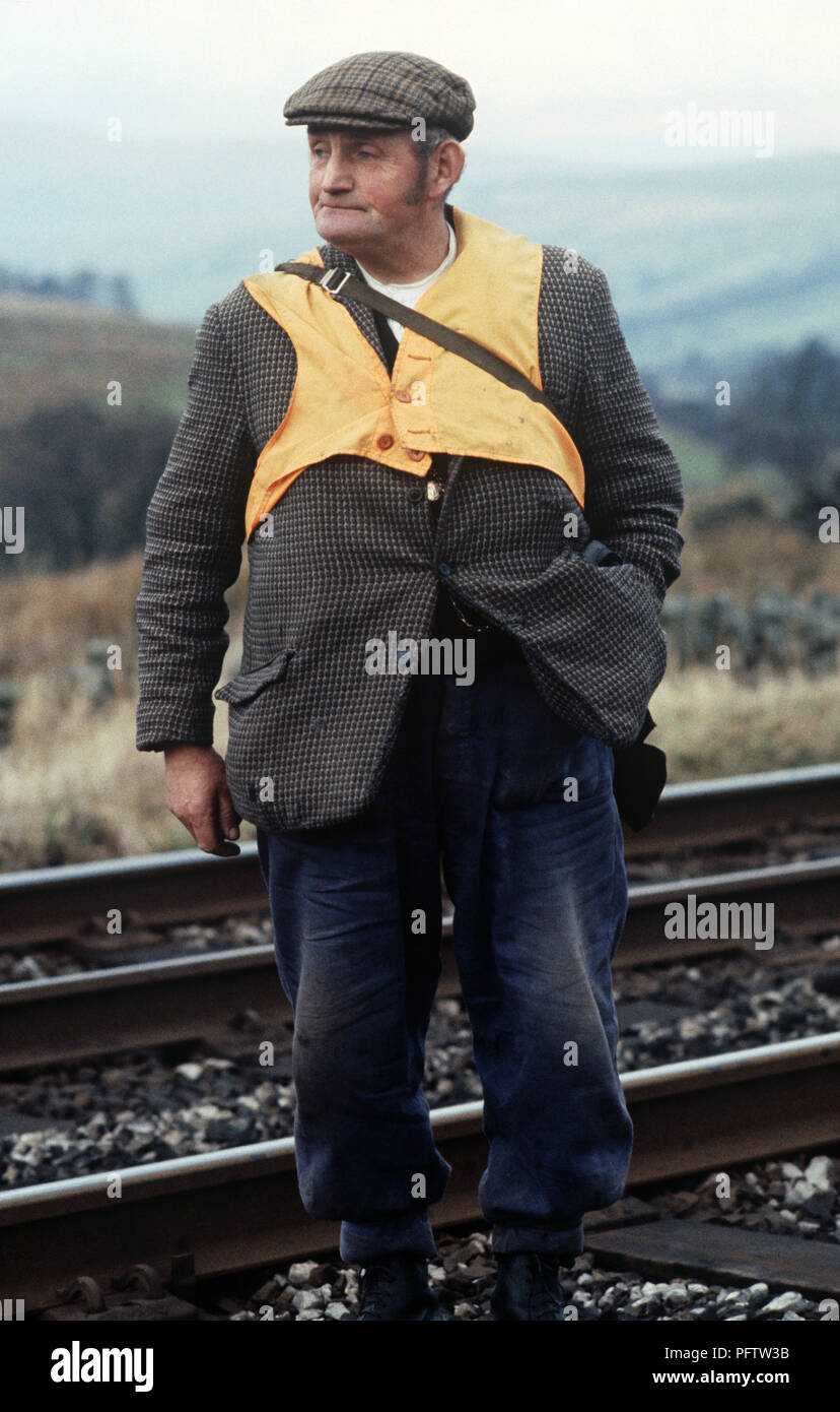 British Rail line workers wearing orange safety jackets on the Settle ...