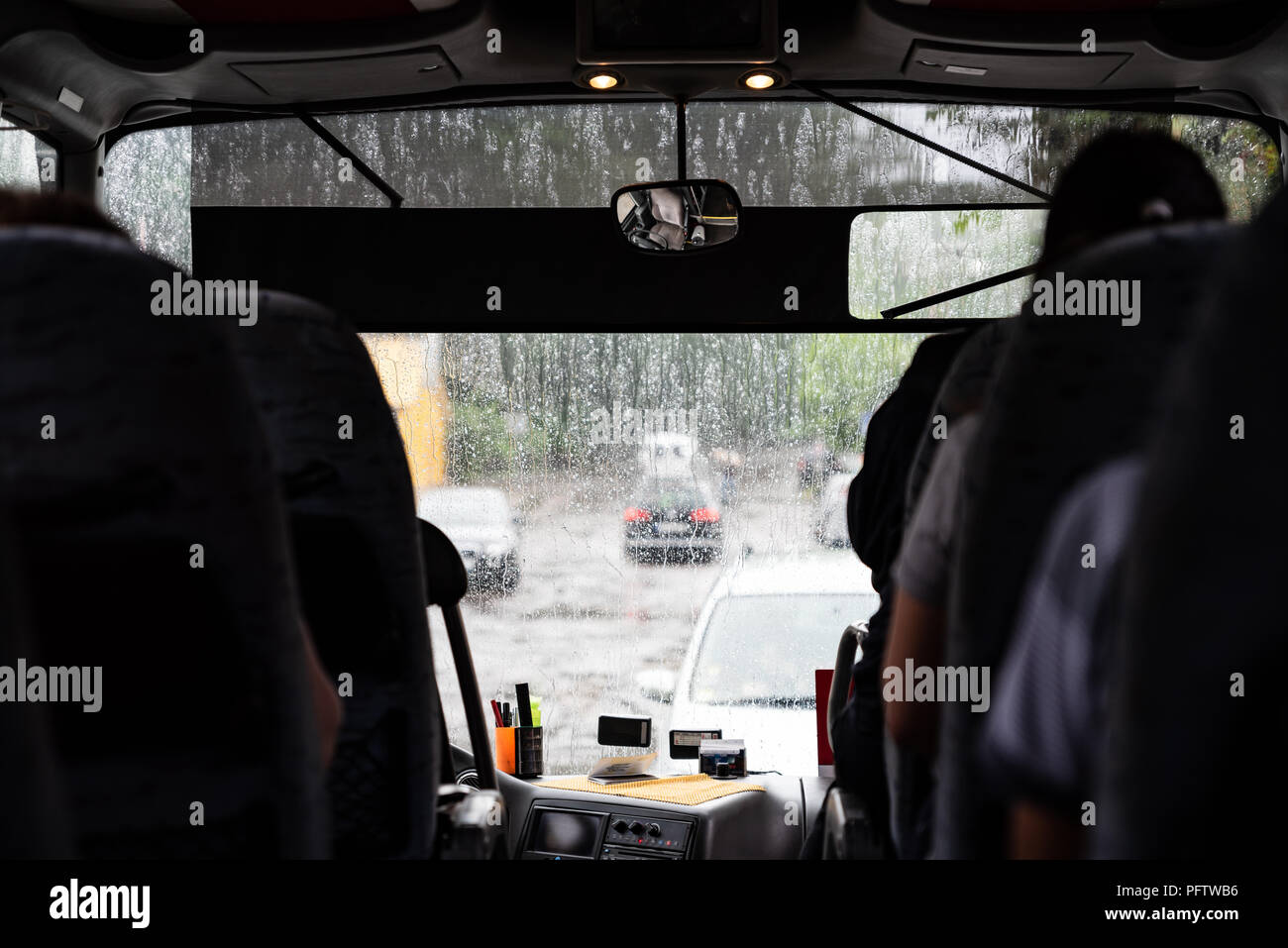 Bad weather outside, view from inside to street through the window, bus ...