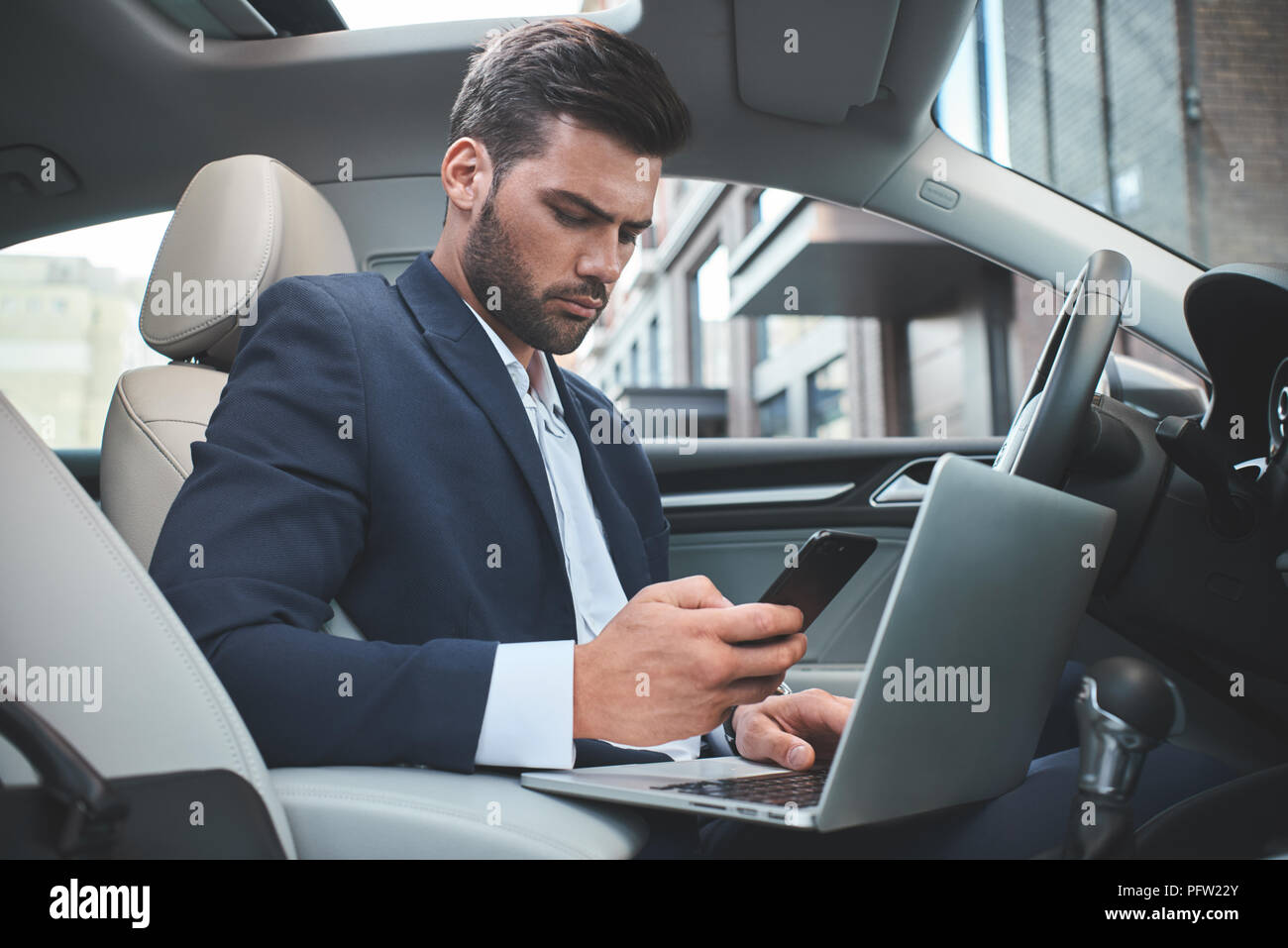 Businessman laptop car hi-res stock photography and images - Alamy
