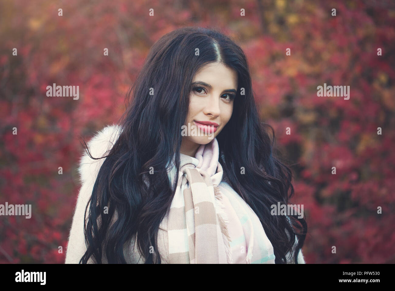 Happy autumn woman in fall park, female face closeup. Brunette woman ...