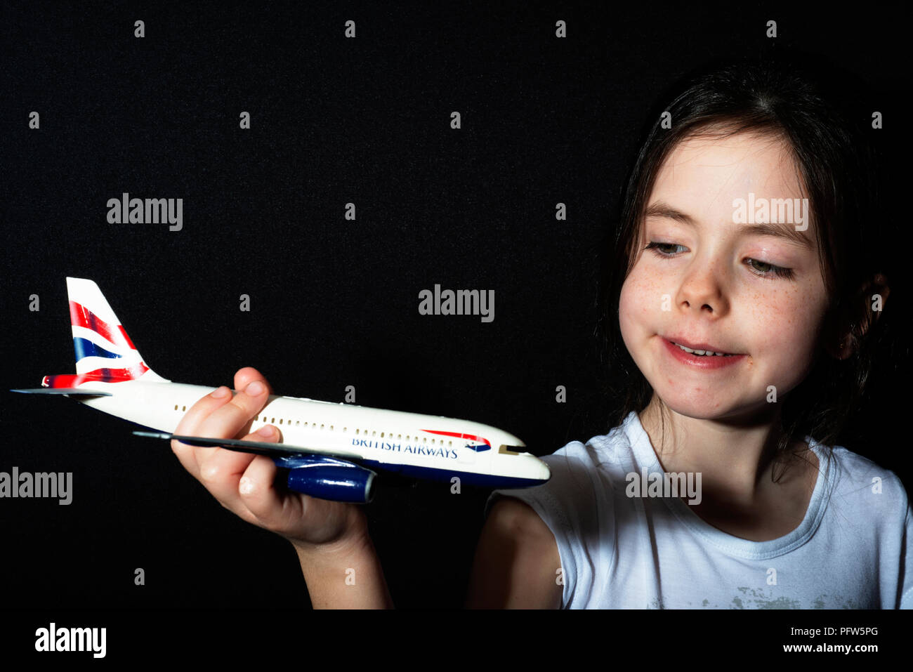 Girl girl hold a airbus a319 model aircraft hi-res stock photography ...