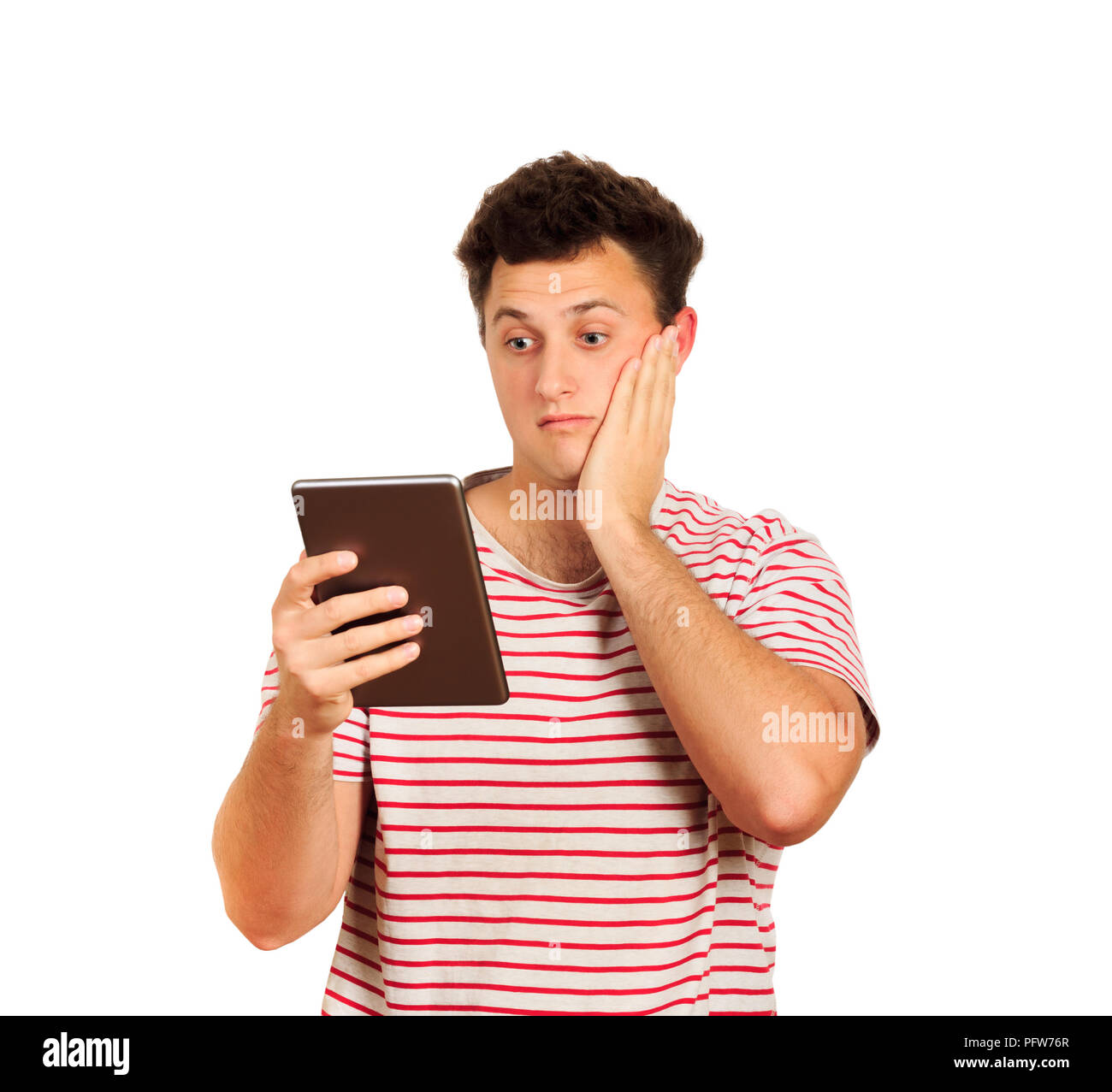 shocked guy looking at camera and holding a tablet computer. emotional ...