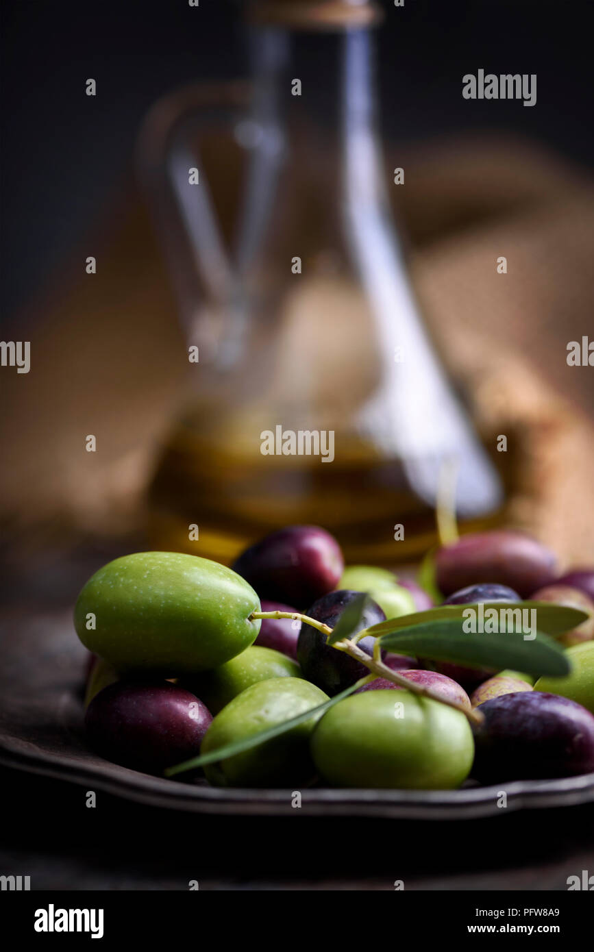 Still life with olives and olive oil Stock Photo - Alamy