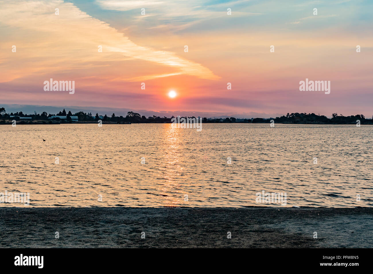 sunset at the beach Stock Photo - Alamy
