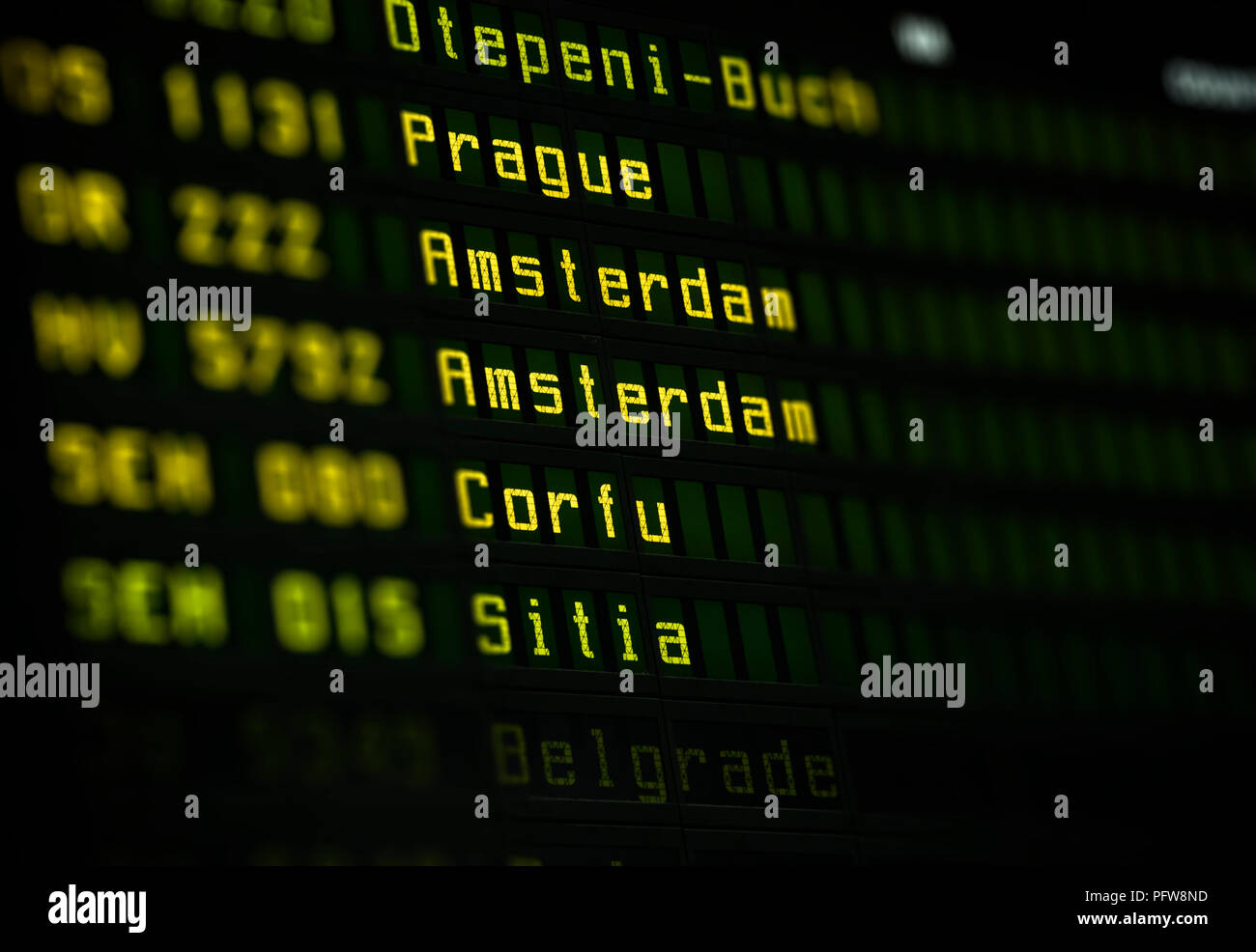 Flight information board at airport terminal closeup Stock Photo - Alamy