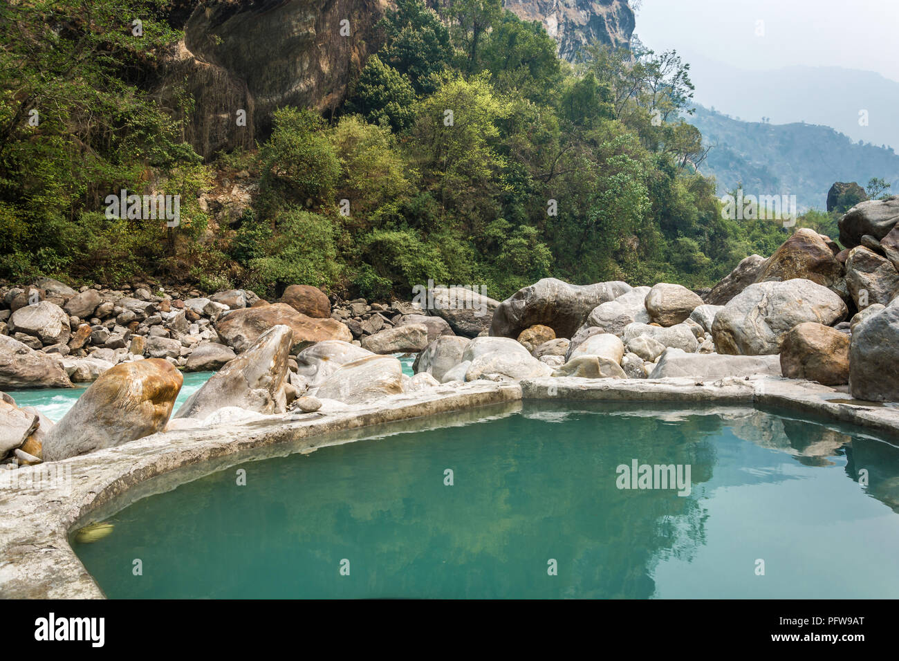 Natural hot spring in the Himalayas on a spring day, Nepal Stock Photo ...