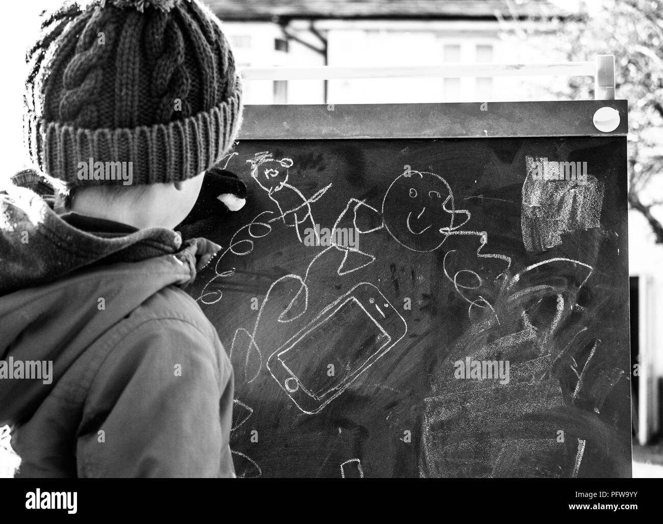 Boy blackboard Black and White Stock Photos & Images - Alamy