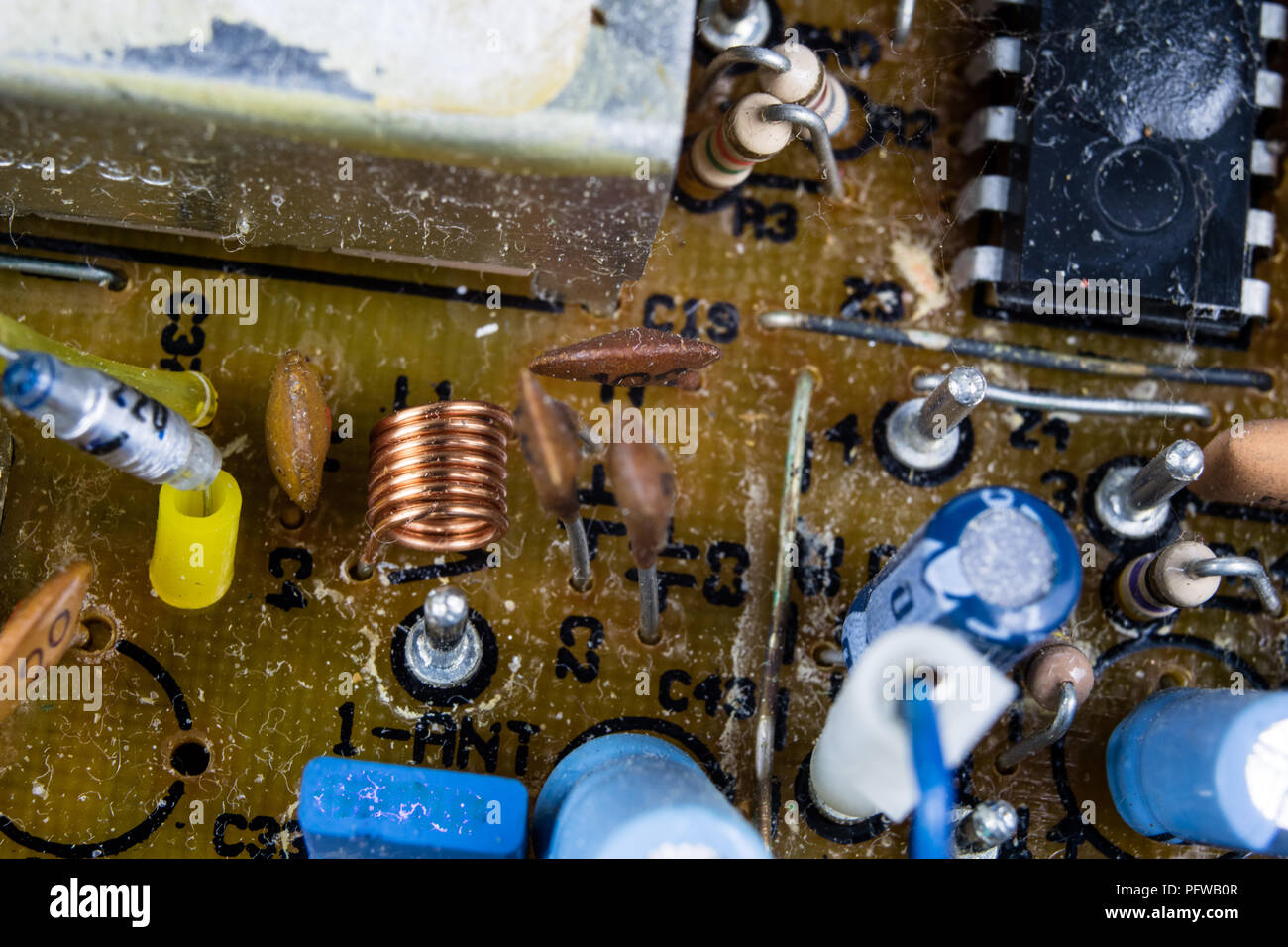 Old integrated circuits in an analog radio receiver. Resistors ...