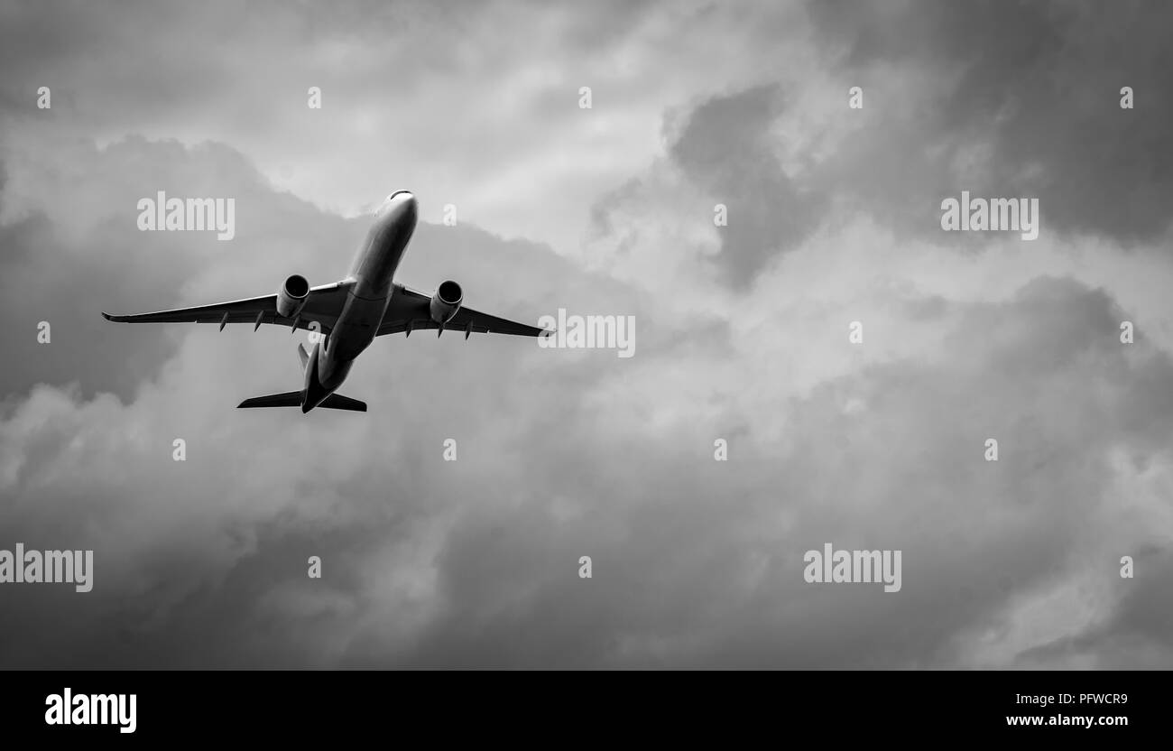 Commercial airplane on grey sky and clouds with copy space. Failed ...