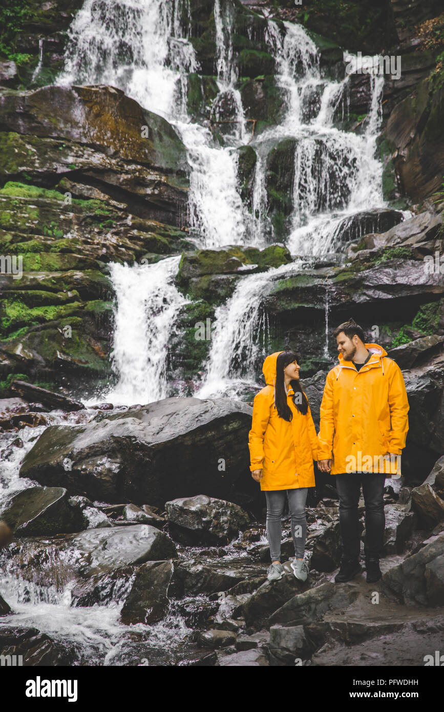 Two people in raincoats in hi-res stock photography and images - Alamy