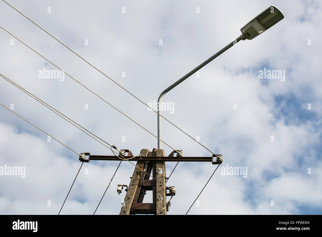 pole with electric cables and lighting Stock Photo - Alamy