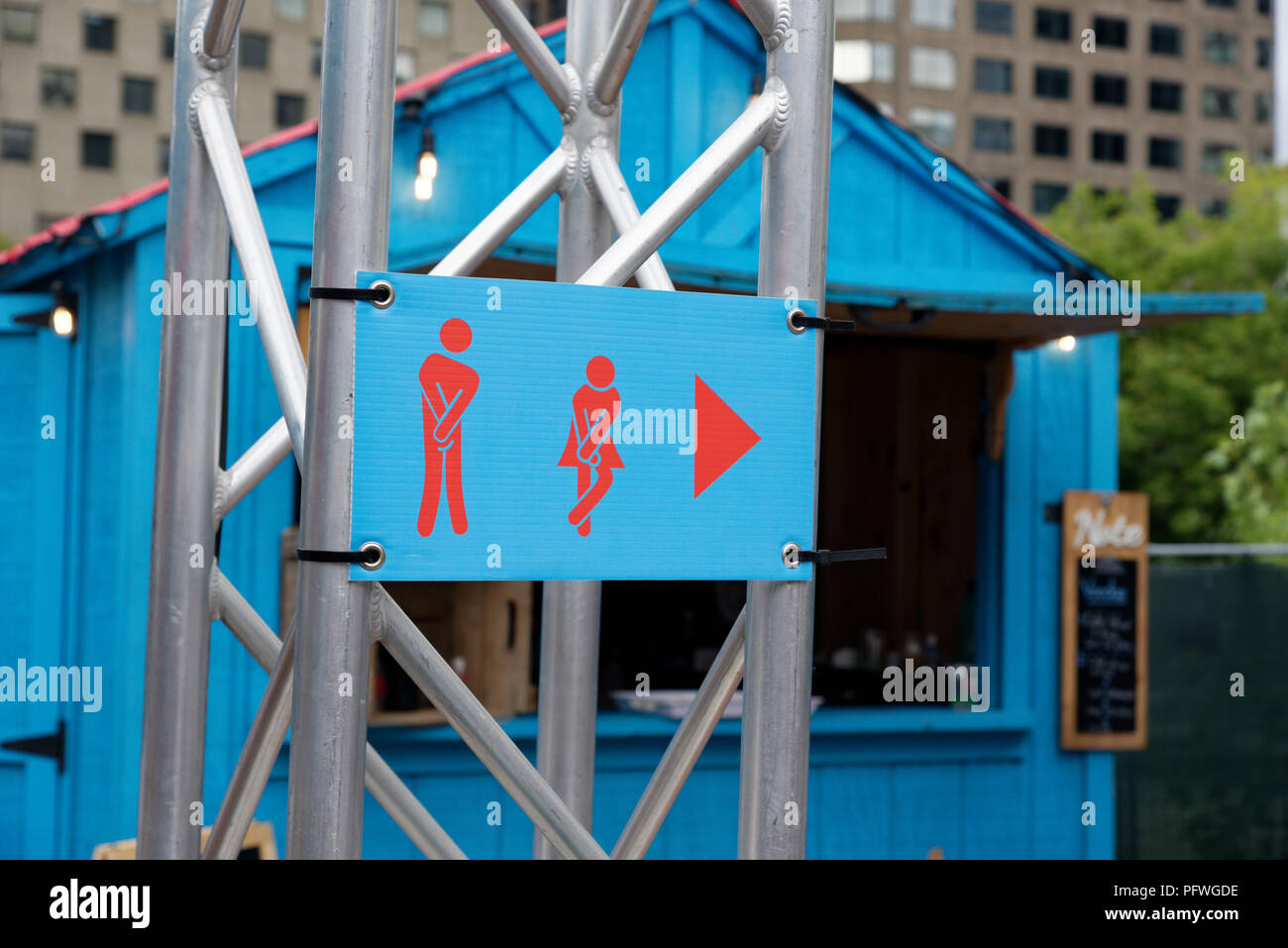 A funny sign for public toilets, showing a silhouette of a man and a ...