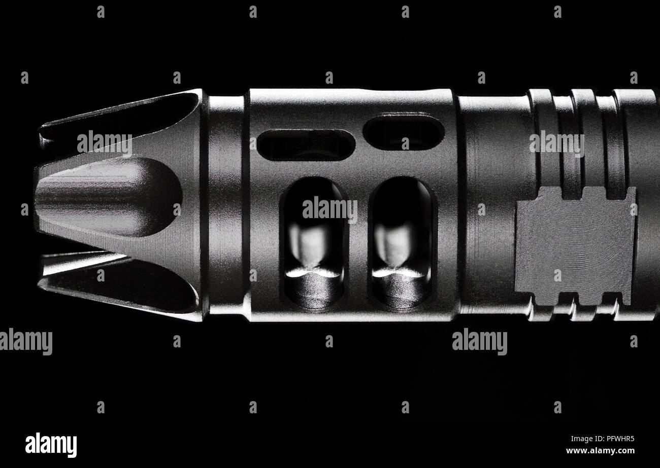 Compensator used on an assault rifle on a black background Stock Photo ...