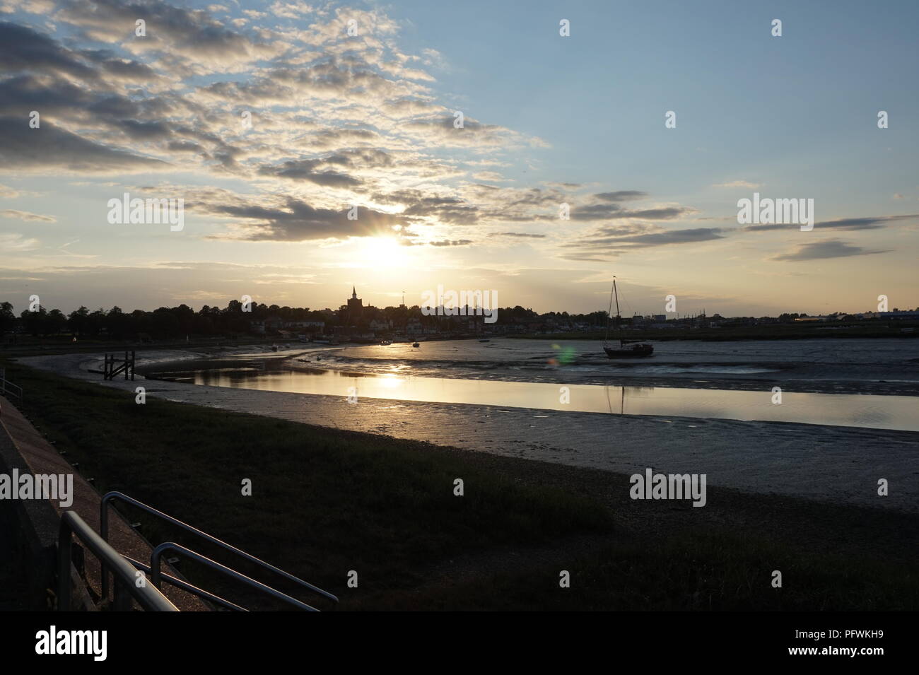 Sunset on the harbour Stock Photo - Alamy