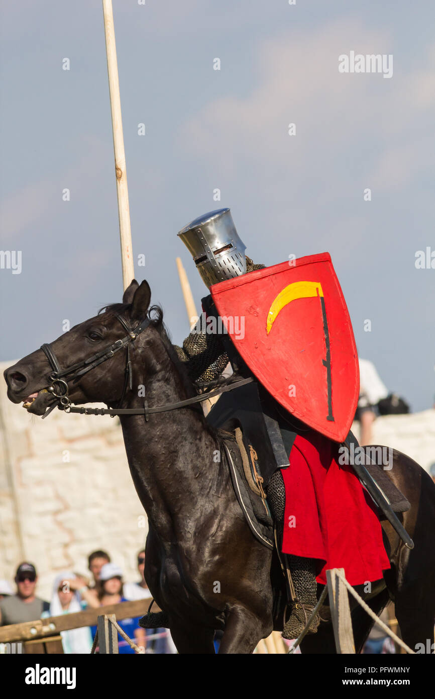 Bulgar, Russian Federation - August 2018, - knight in armor, in a red ...