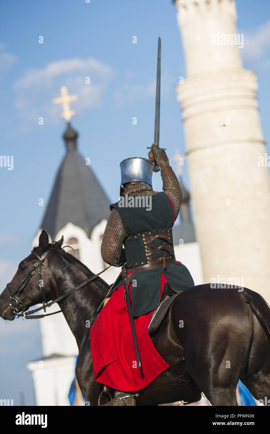Bulgar, Russian Federation - August 2018, - knight in armor raised his ...