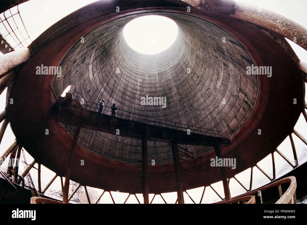 Engineers examine the giant cooling tower at the former BSC Tinplate ...