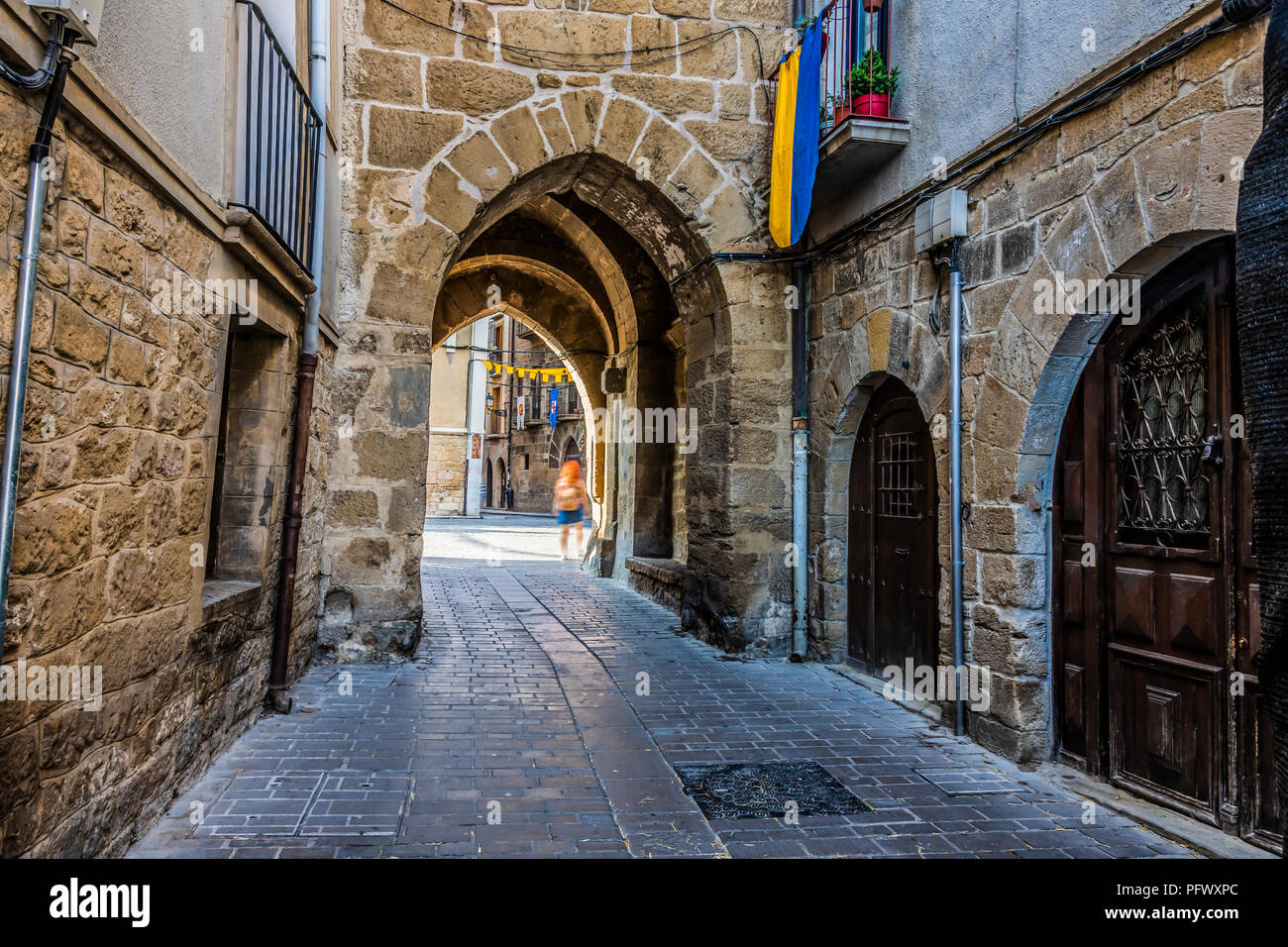 Passage with arches in the historic center of the medieval town of ...