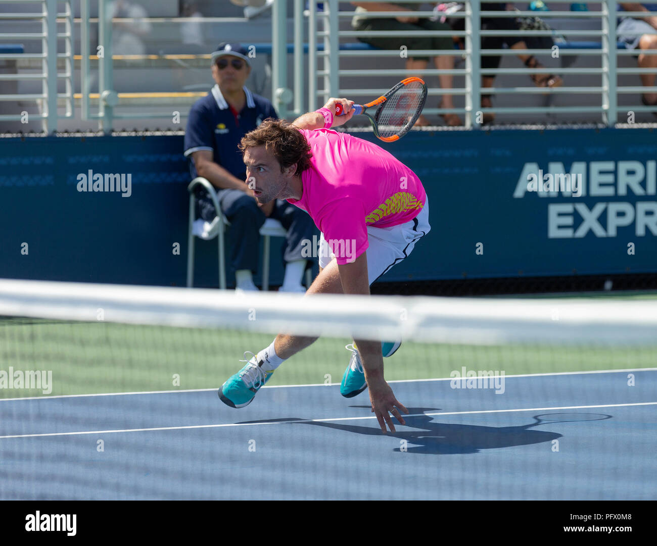 Ernest Gulbis of Latvia returns ball during qualifying day 1 against ...