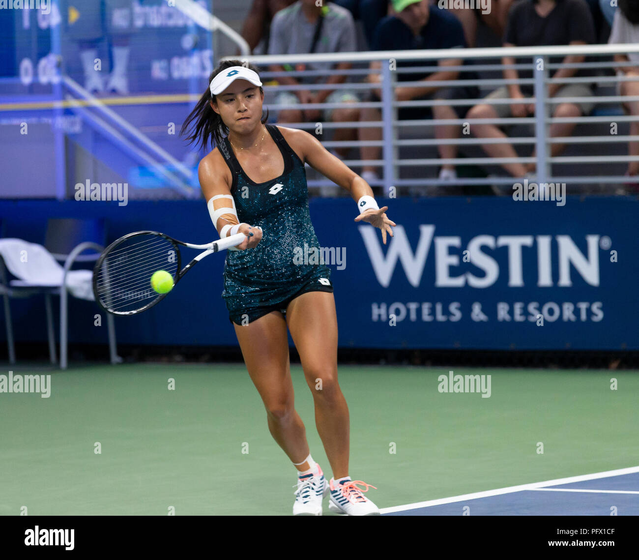 Carol Zhao of Canada returns ball during qualifying day 1 against ...