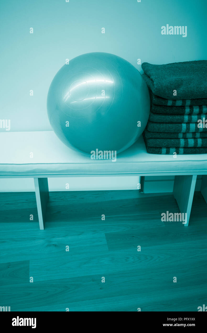 Pilates yoga fitness studio gym room with bench seat waiting and ...