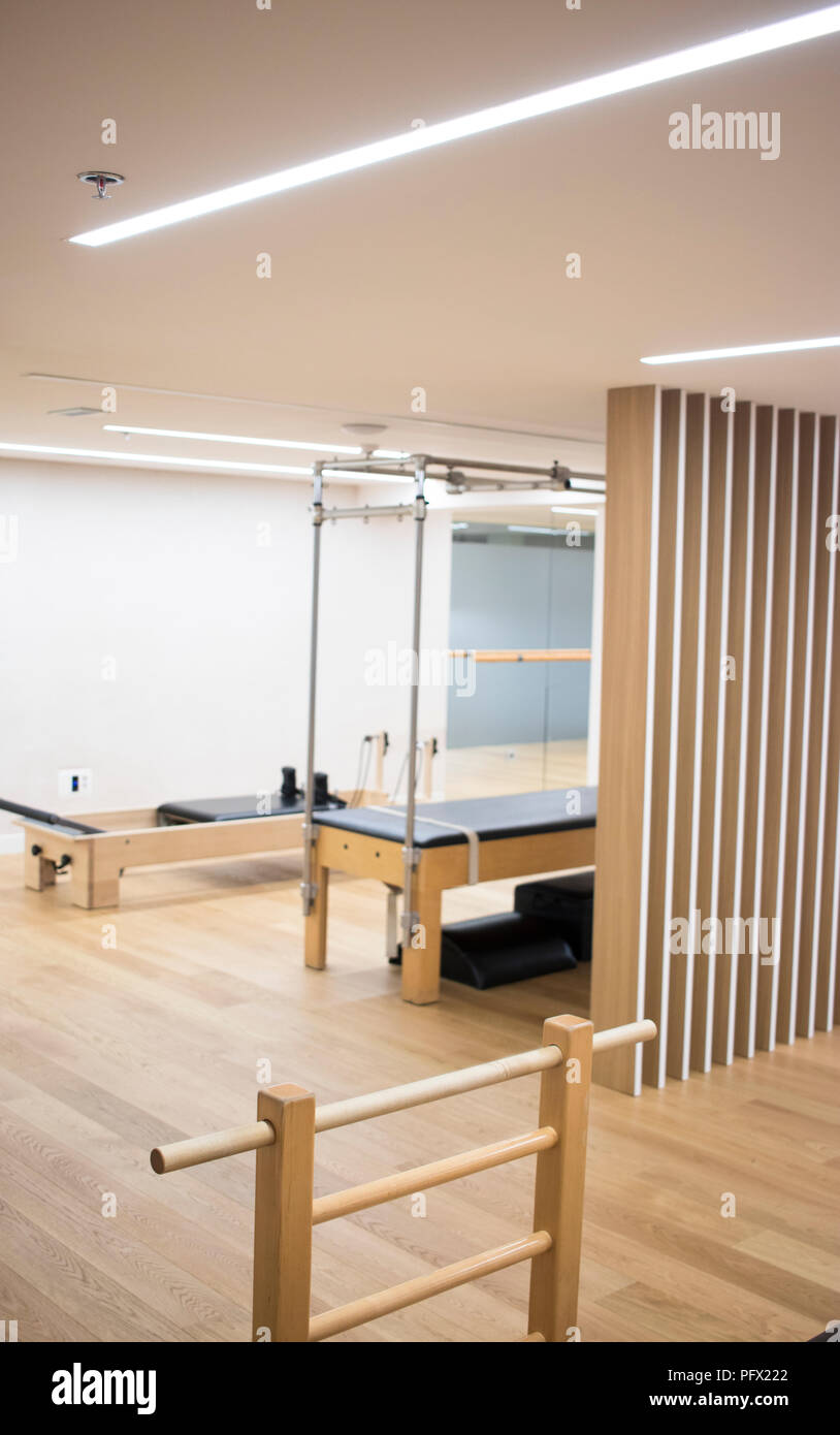 Pilates machine fitness studio gym room with training barrel Stock ...