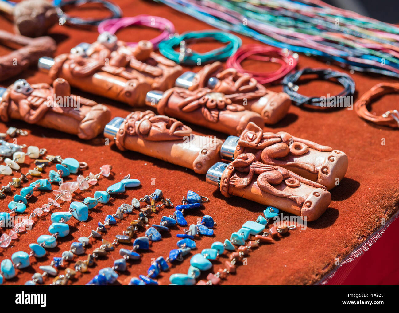 Local handmade souvenirs on the city street, Puerto Montt, Chile. Close ...