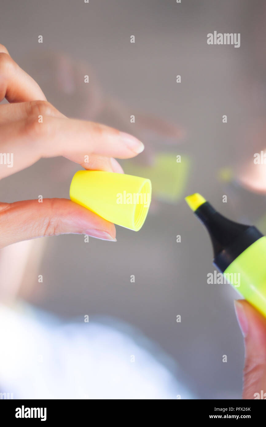 Felt tip permanent highlighter color ink marker pen in hand of young ...