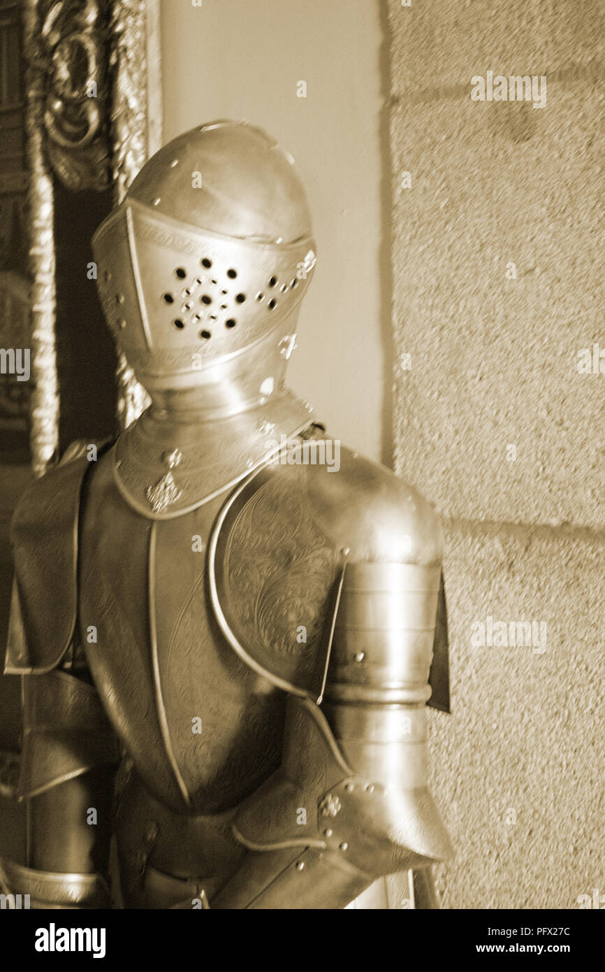 Medieval metal suit of armour and helmet worn by knight in middle ages ...