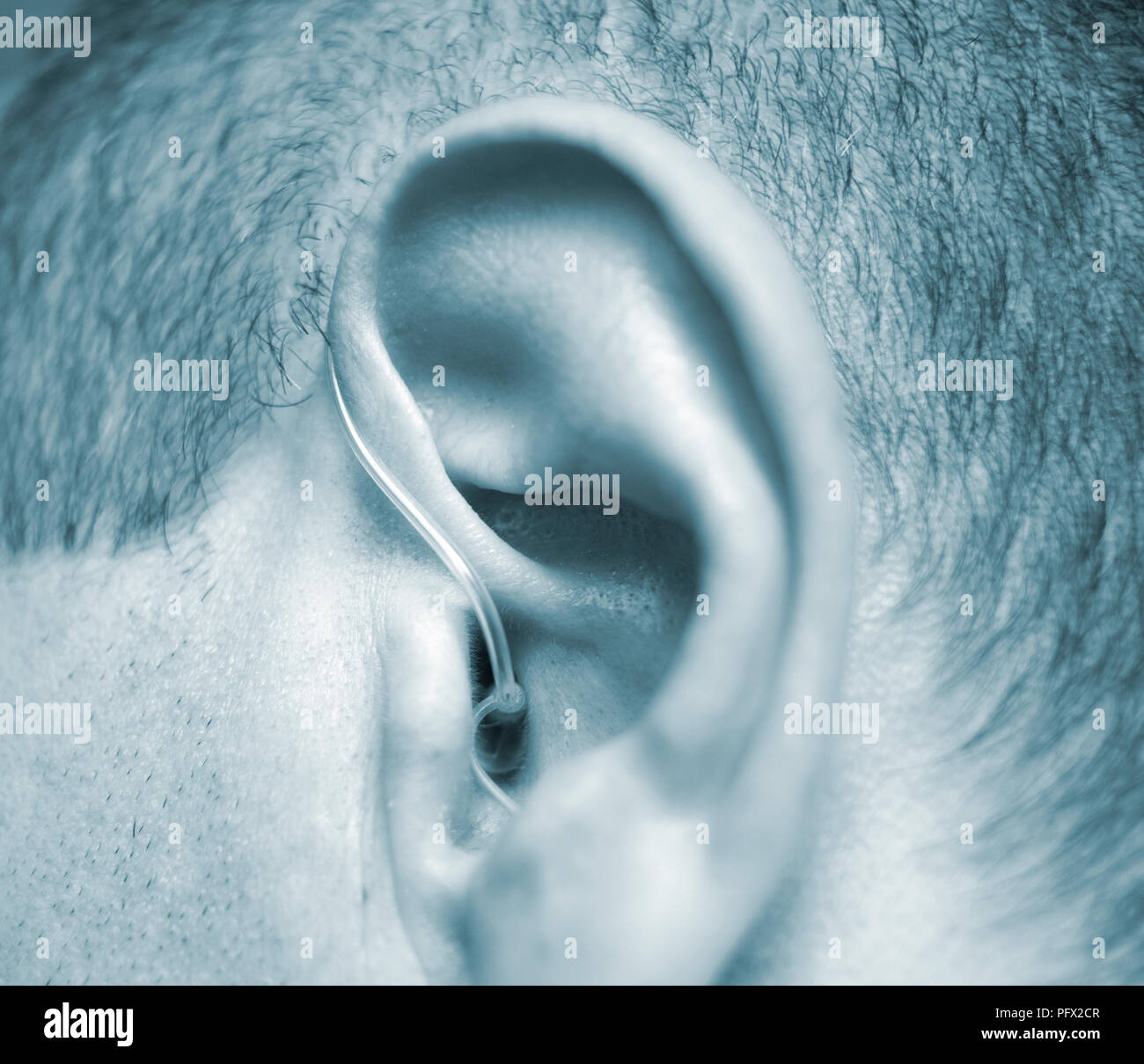Modern compact in the ear digital audiophone hearing aid in the ear of ...
