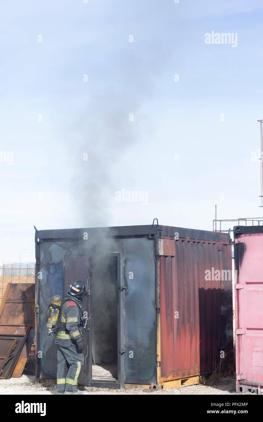 Firefighter putting out fire training station extinguisher backdraft ...