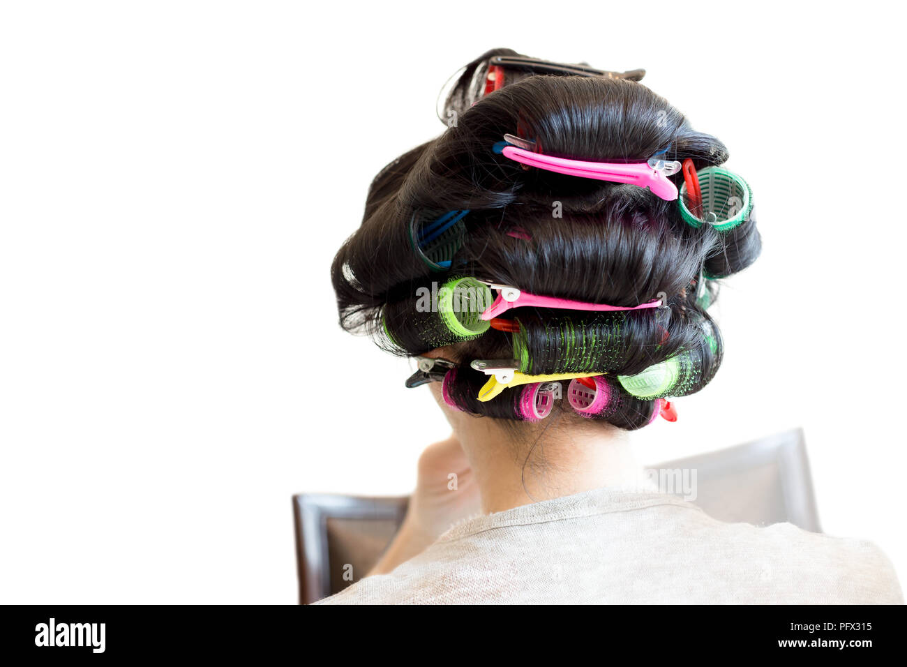 Back view asian woman with her hair in rollers isolated Stock Photo - Alamy