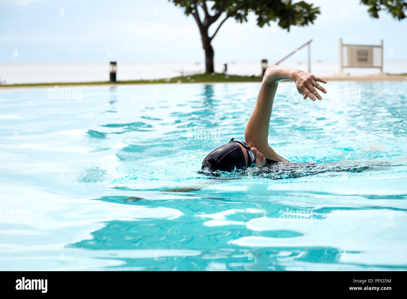 Wearing Blue Swimsuit And Swimming High Resolution Stock Photography ...