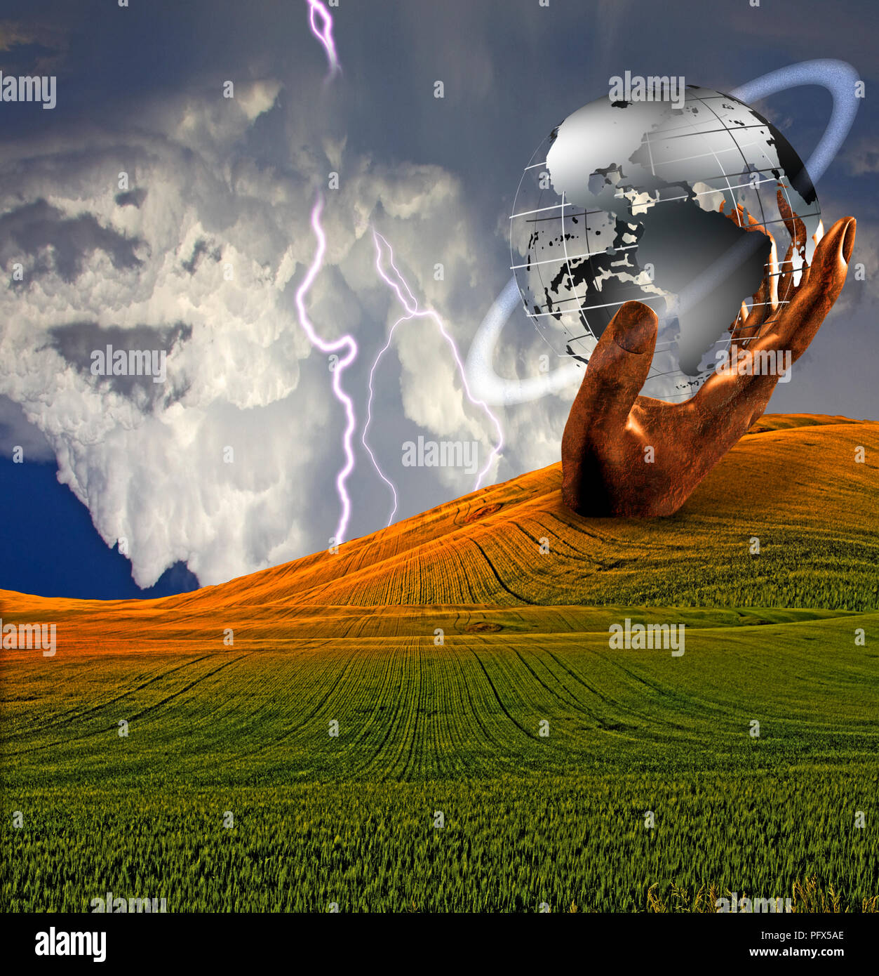 Large hand and earth sculpture in landscape Stock Photo - Alamy