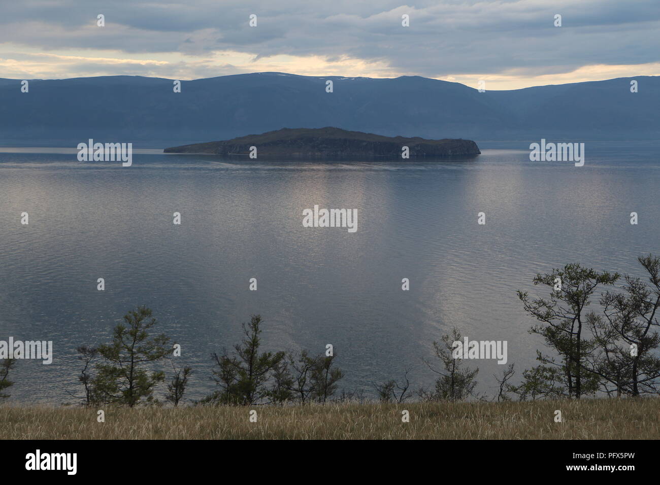 an evening view of Baikal lake and surrounding mountains; Olkhon island ...